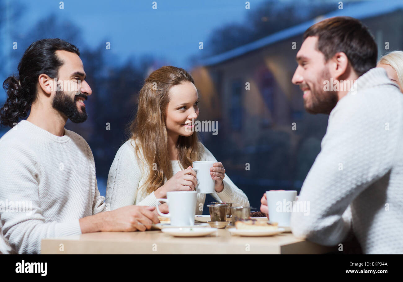 happy friends meeting and drinking tea or coffee Stock Photo - Alamy