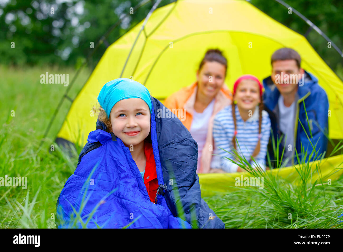 Young girl camping Stock Photo - Alamy