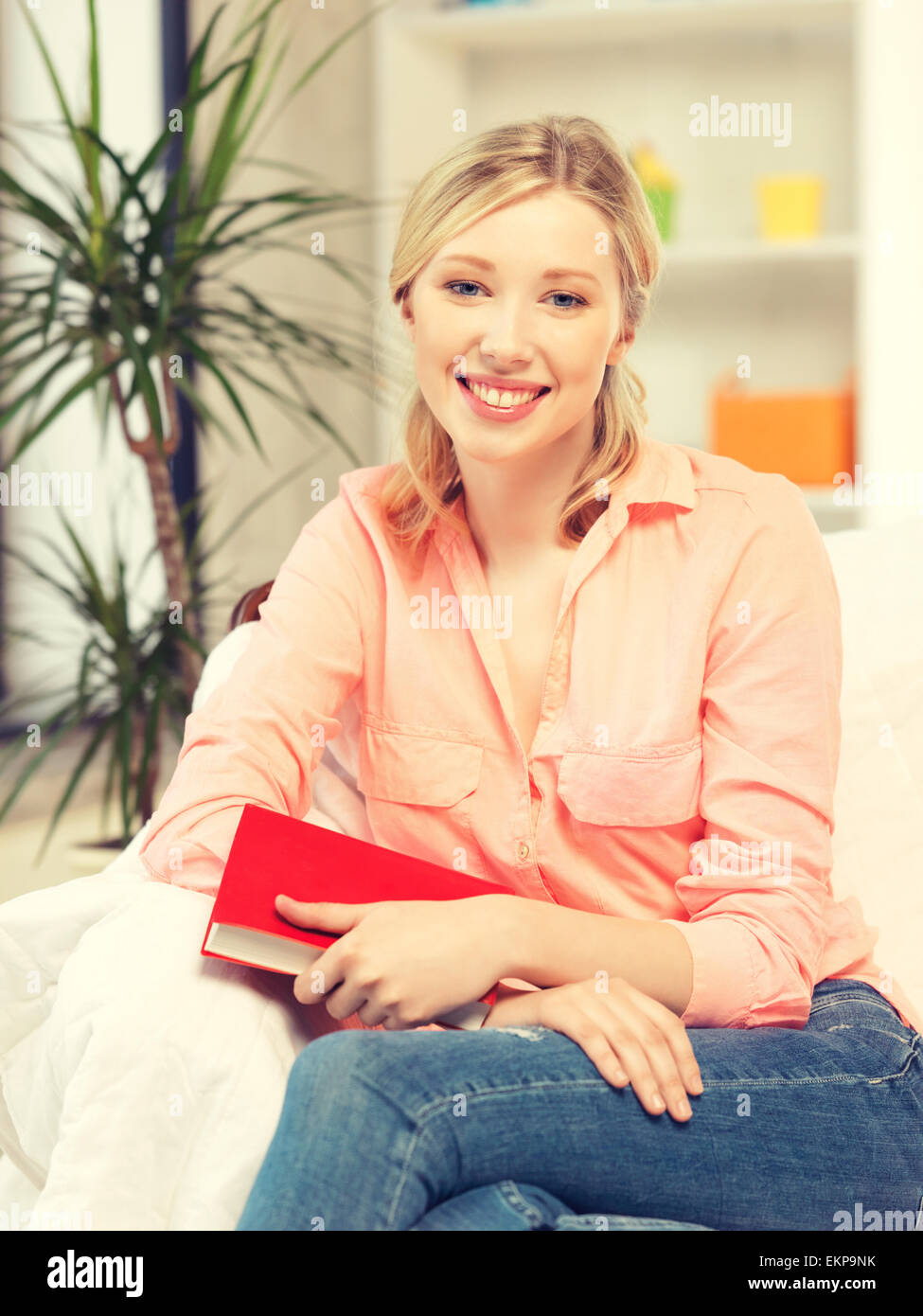 happy and smiling woman with book Stock Photo - Alamy