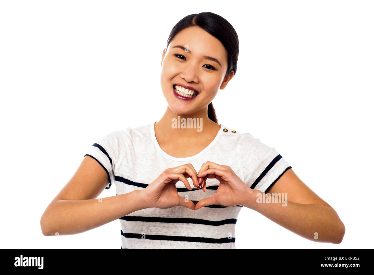 Pretty woman making heart symbol with hands Stock Photo - Alamy
