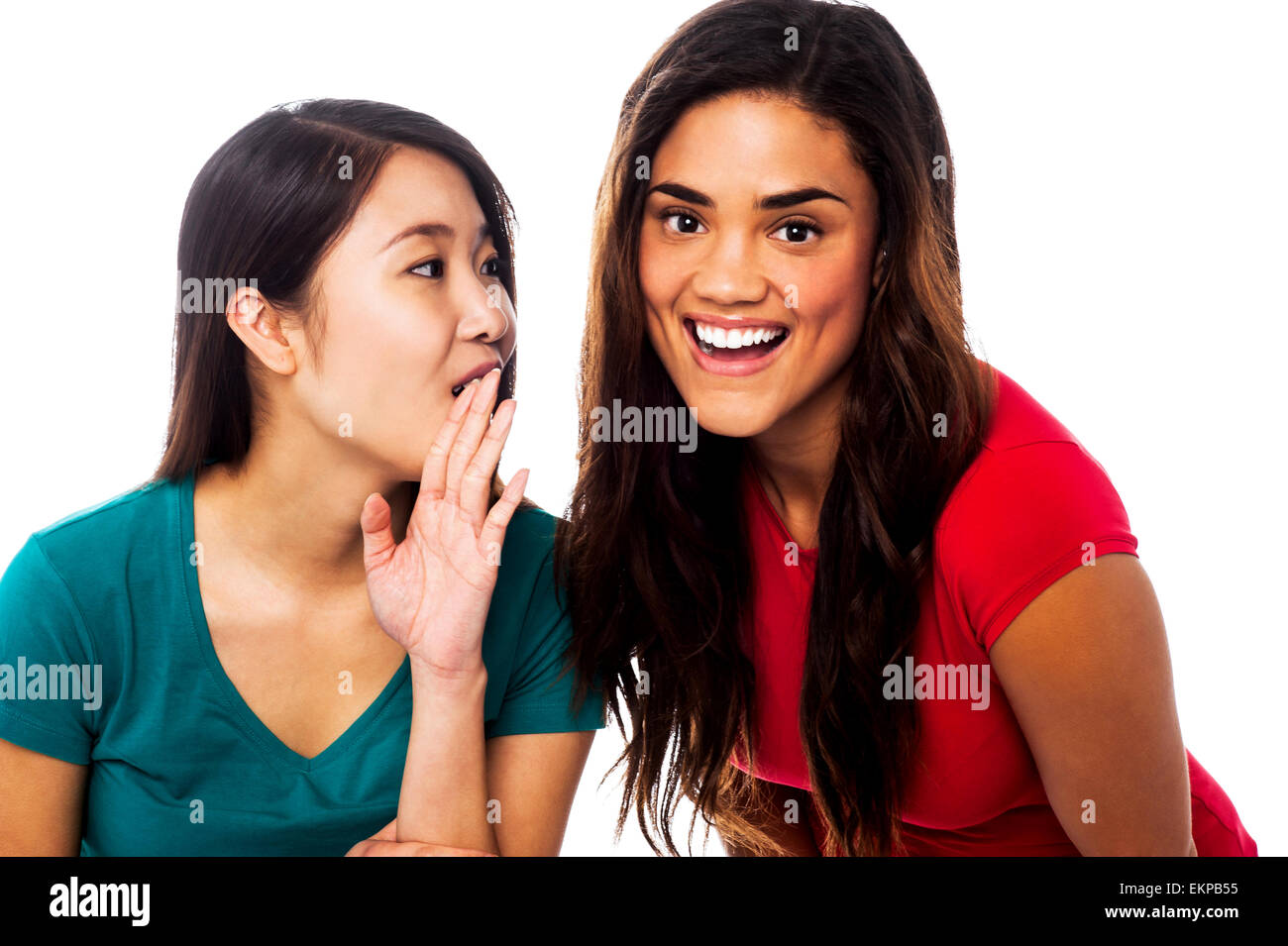 Two young girls gossiping Stock Photo - Alamy