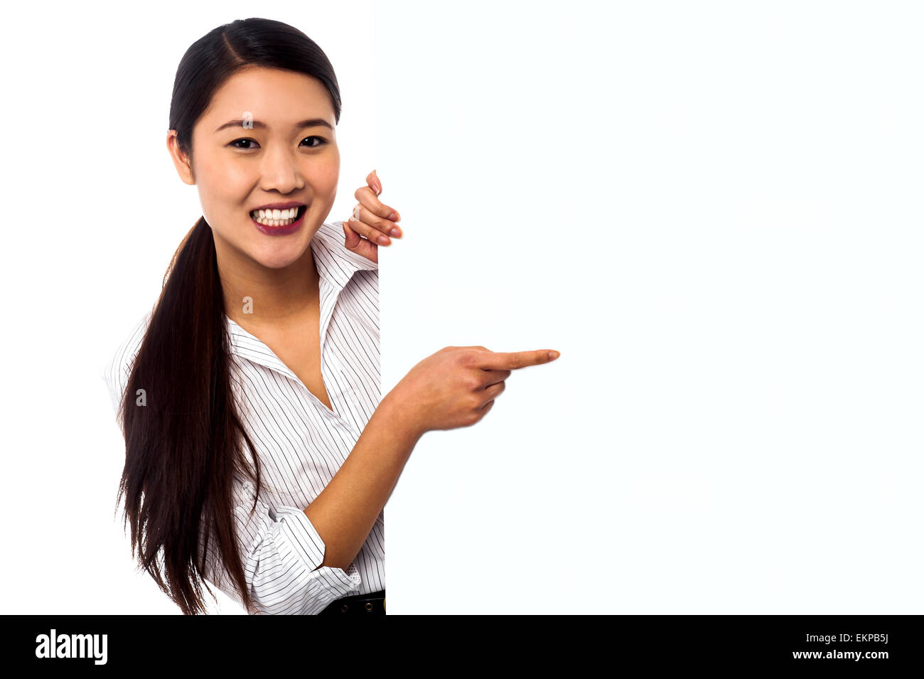 Business lady pointing towards ad on billboard Stock Photo - Alamy
