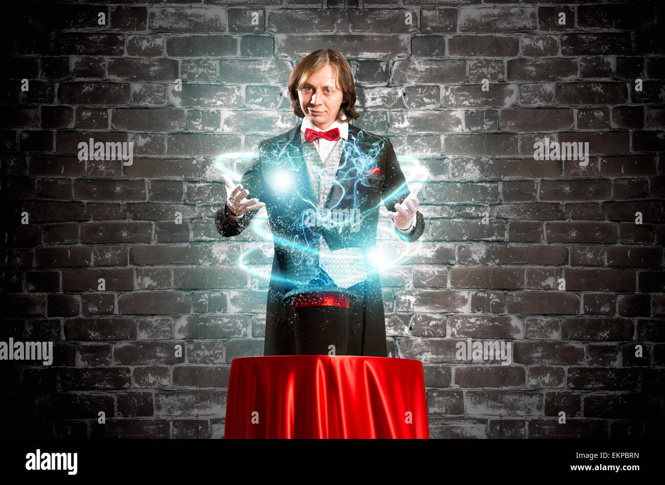 magician causes the magic out of the hat Stock Photo - Alamy
