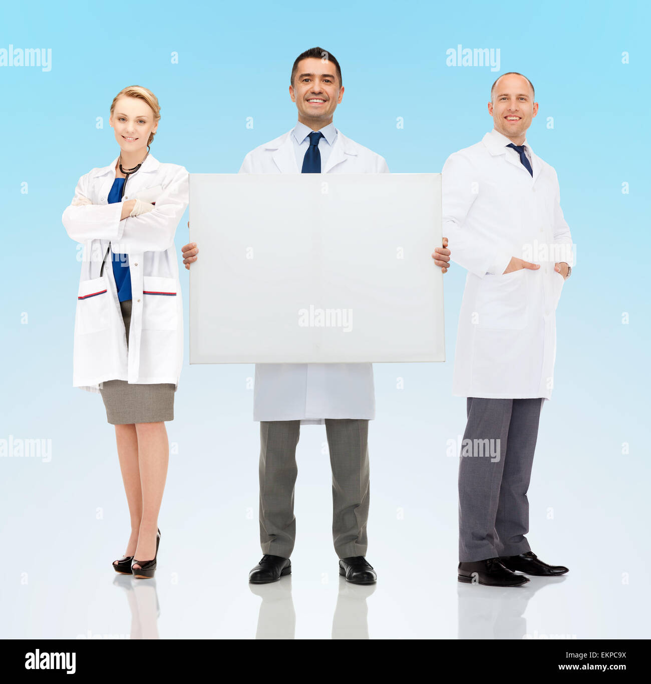 group of smiling doctors holding white blank board Stock Photo - Alamy