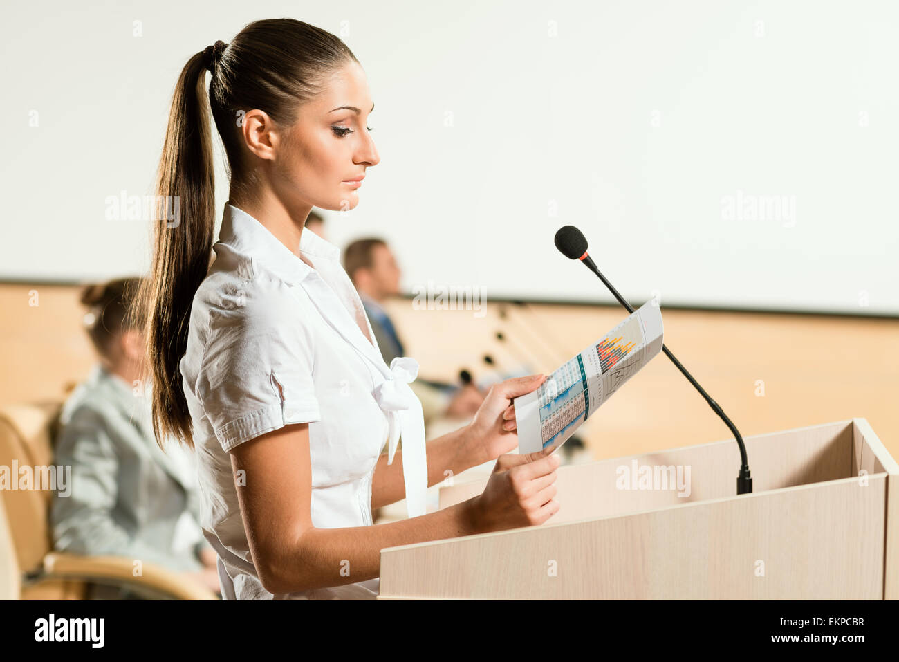 Portrait of a business woman with microphone Stock Photo - Alamy