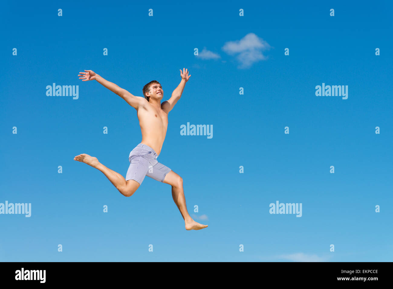 young man jumping Stock Photo - Alamy