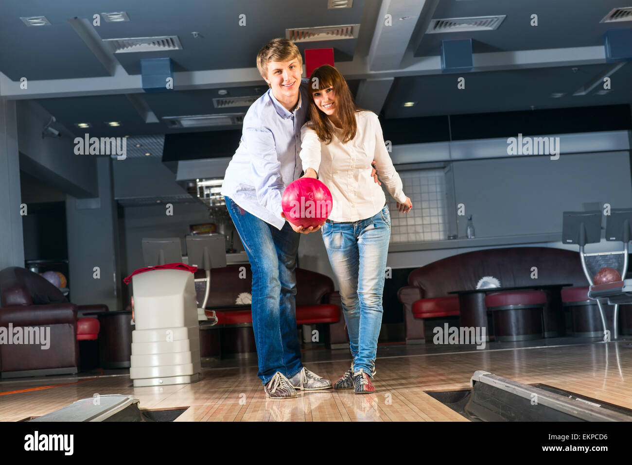 Friends bowling together in club hi-res stock photography and images ...