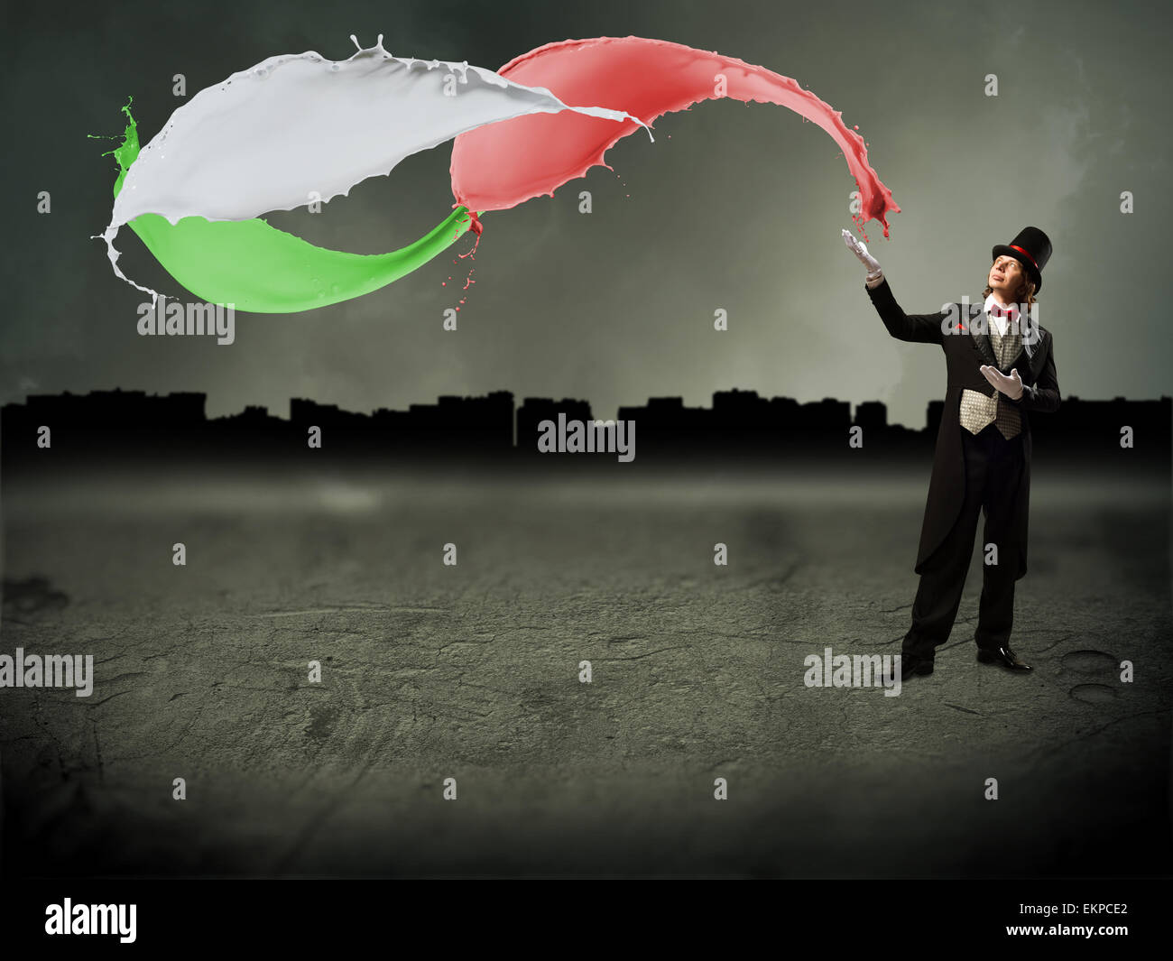 magician and splashes of color paint Stock Photo - Alamy