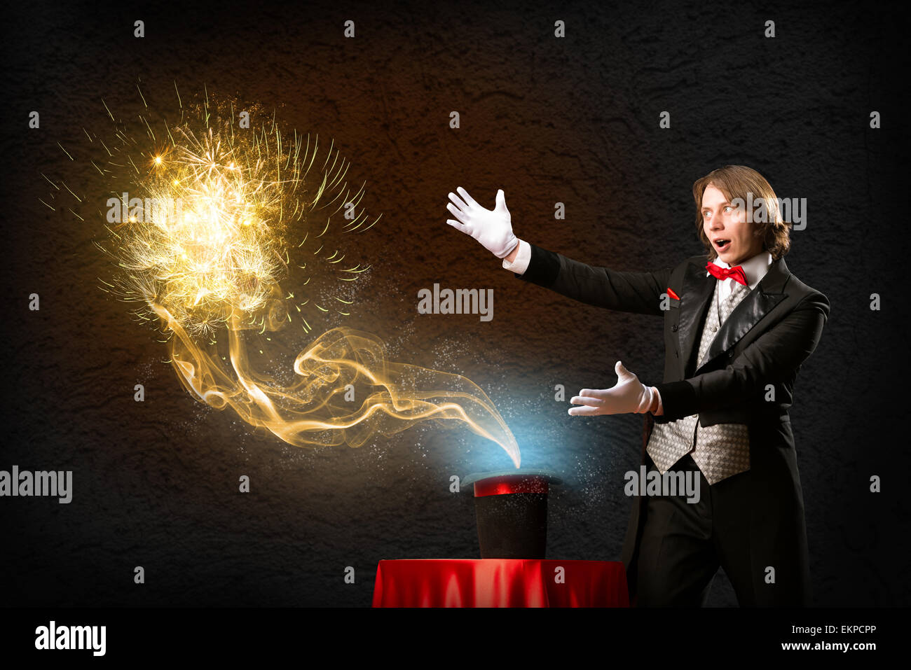 magician causes the magic out of the hat Stock Photo - Alamy