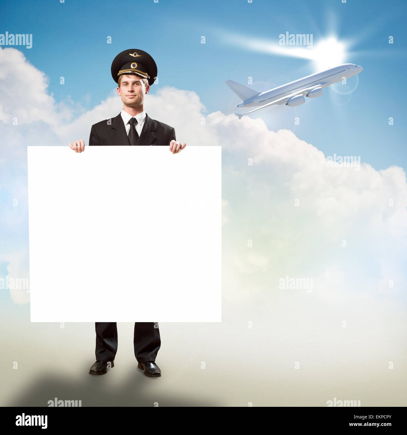 pilot in the form of holding an empty billboard Stock Photo - Alamy
