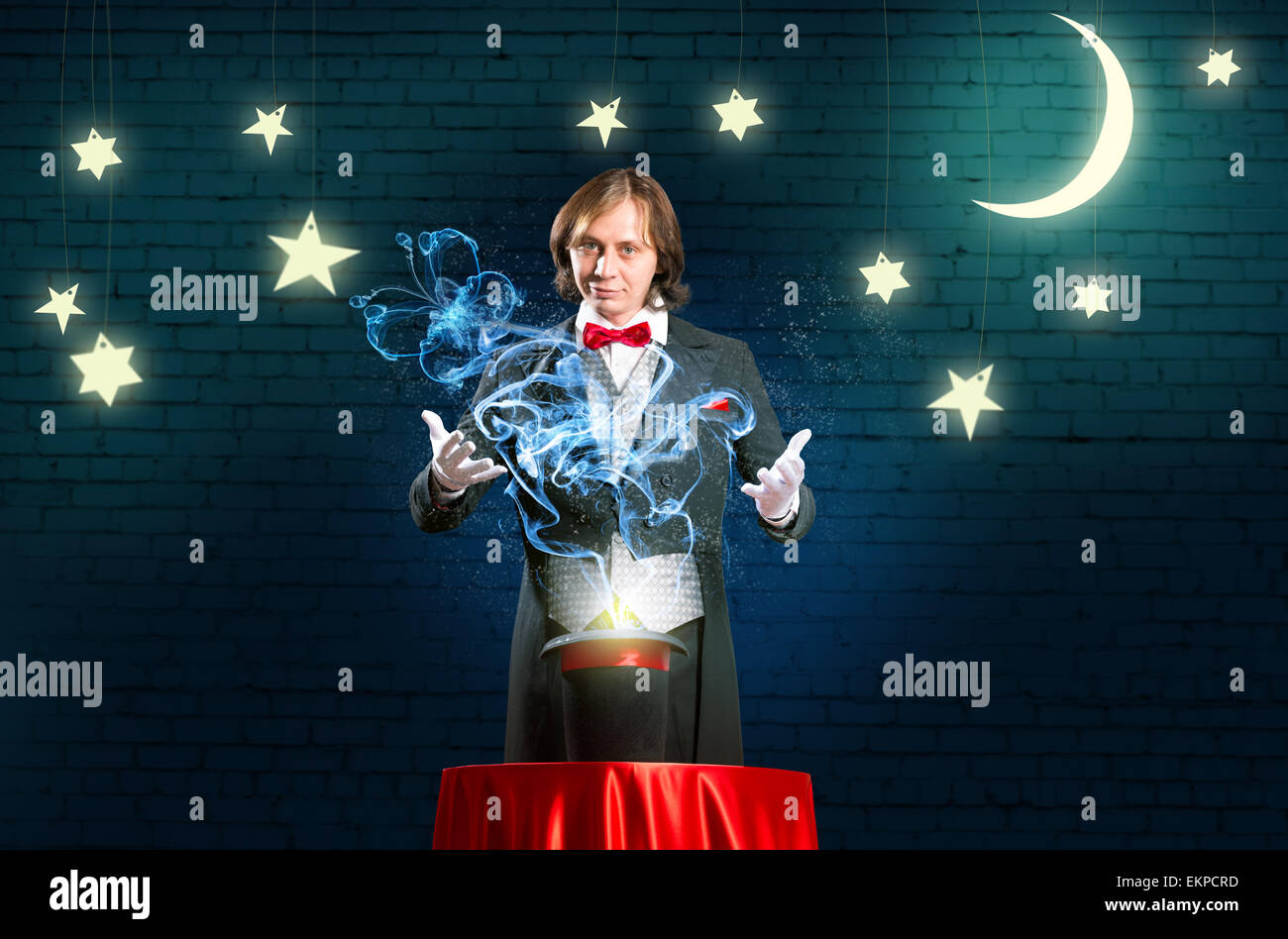 magician causes the magic out of the hat Stock Photo - Alamy
