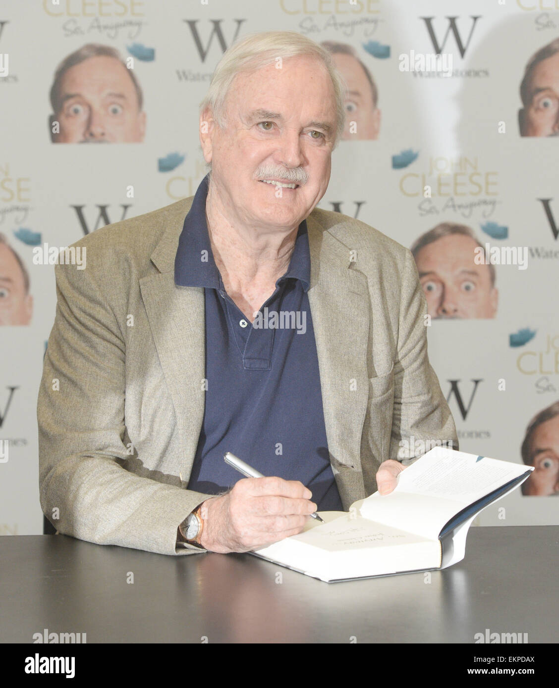 John cleese signs copies of his book hi-res stock photography and ...