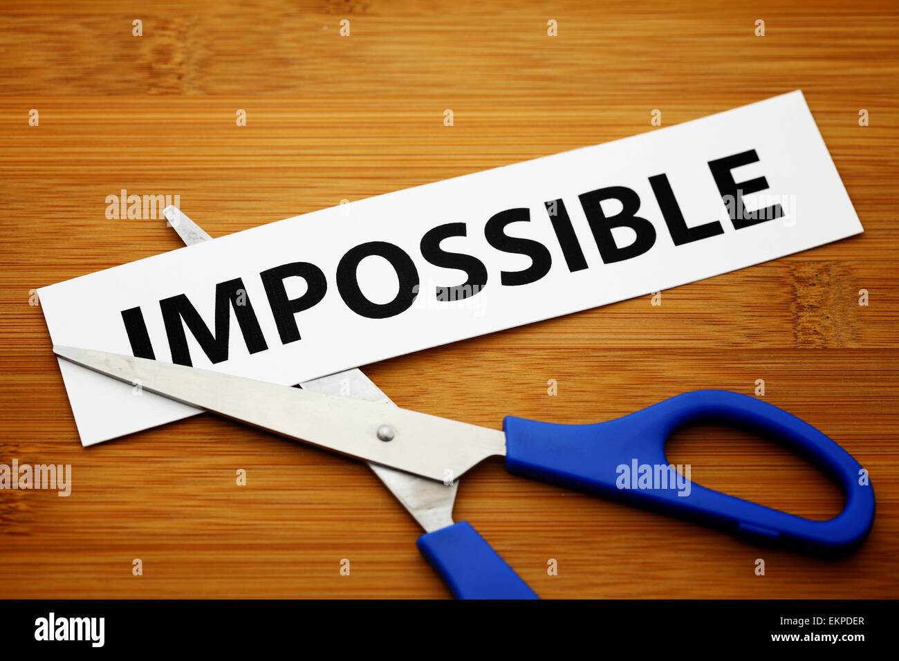 Word impossible cut to possible over wood background Stock Photo - Alamy