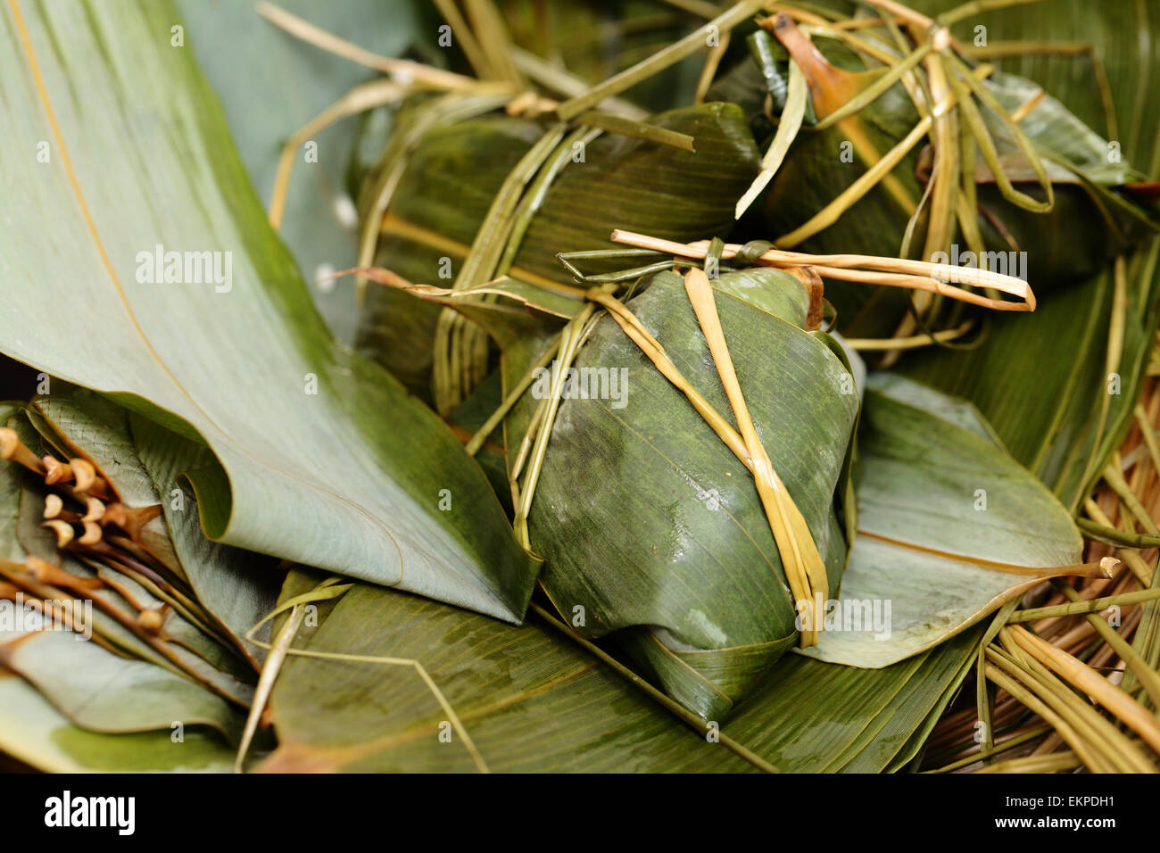Rice dumpling on bamboo leaves Stock Photo - Alamy