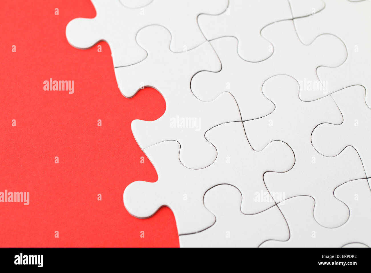 Puzzle with missing part on red background Stock Photo - Alamy