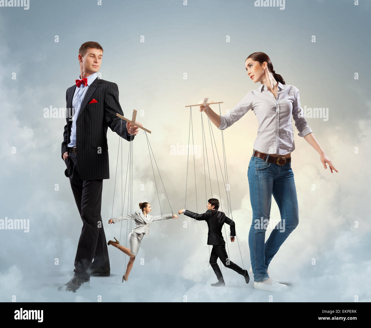 Businesspeople with marionettes Stock Photo - Alamy