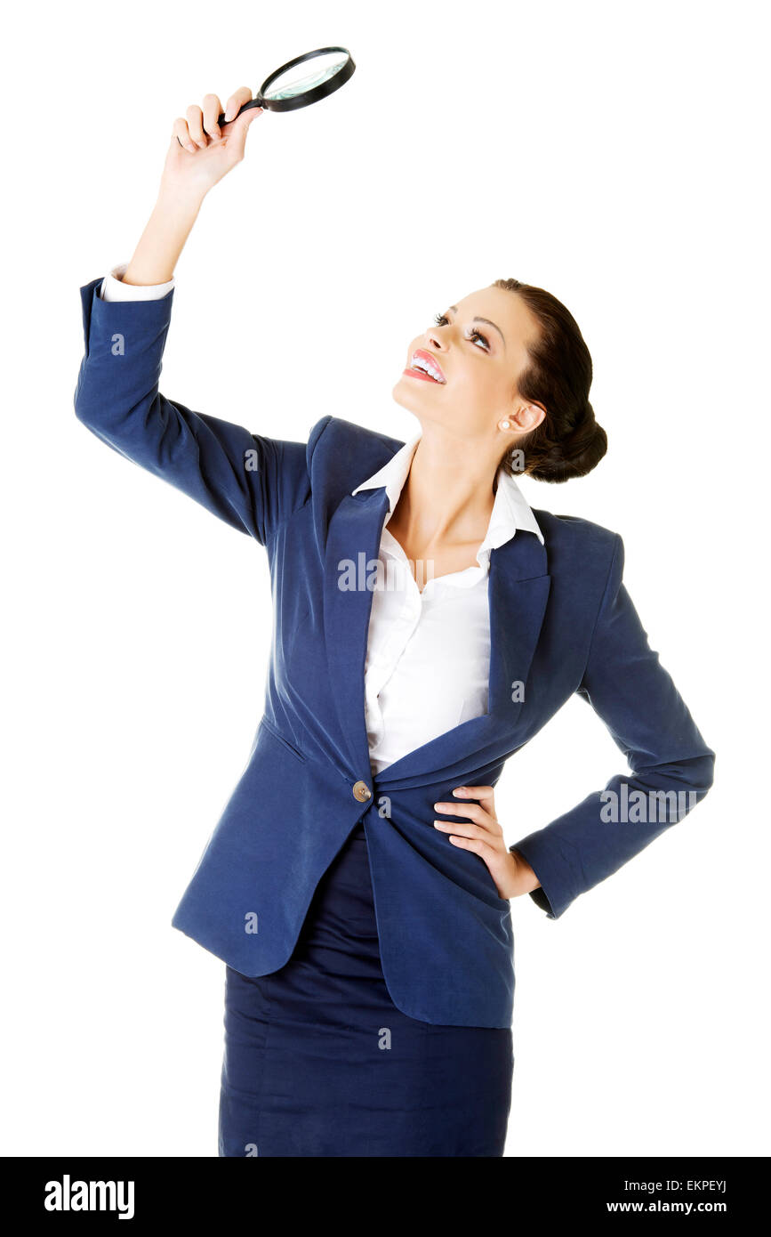 Young attractive business woman looking into a magnifying glass Stock ...