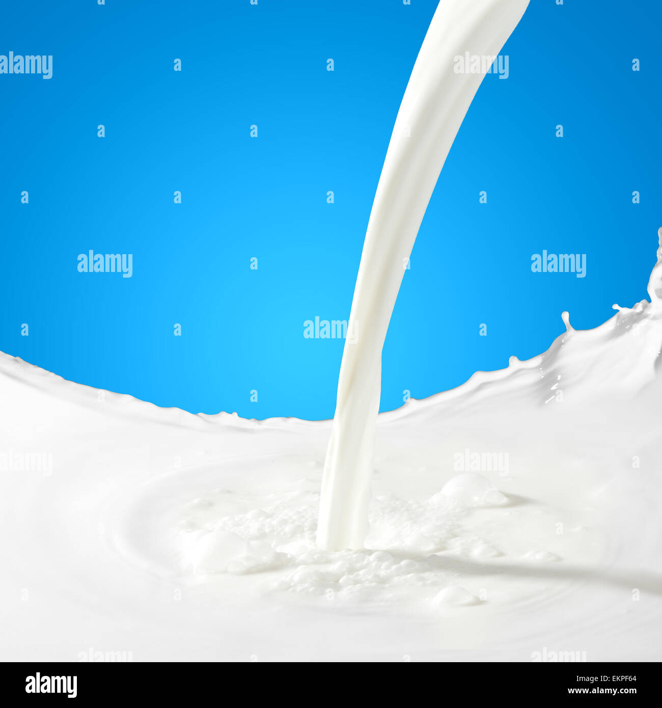 Pouring milk splash Stock Photo - Alamy