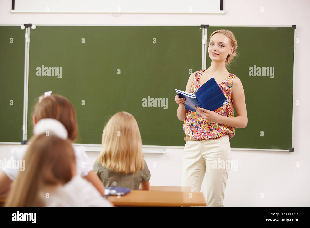 Teacher at school Stock Photo - Alamy