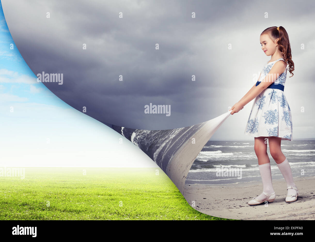 Little girl turning page Stock Photo - Alamy