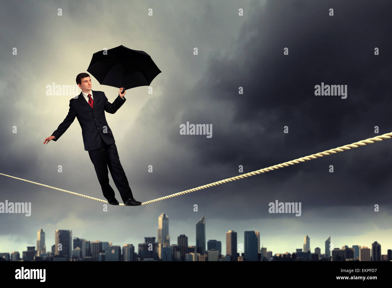 Businessman balancing on rope hi-res stock photography and images - Alamy