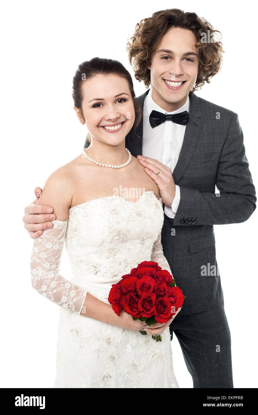 Smart young groom embracing hi-res stock photography and images - Alamy