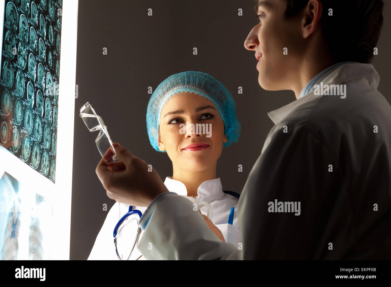Two doctors examining x-ray results Stock Photo - Alamy