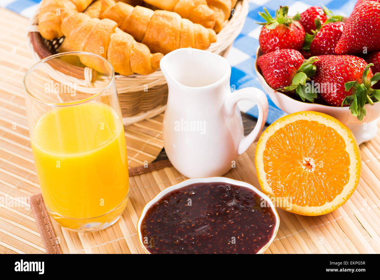 early breakfast, juice, croissants and jam Stock Photo - Alamy