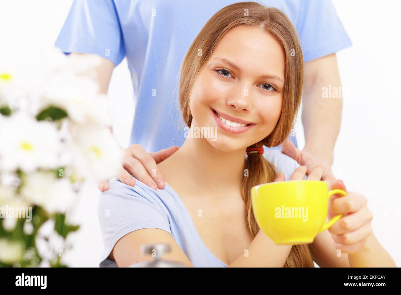 Beautiful young woman drinking tea Stock Photo - Alamy