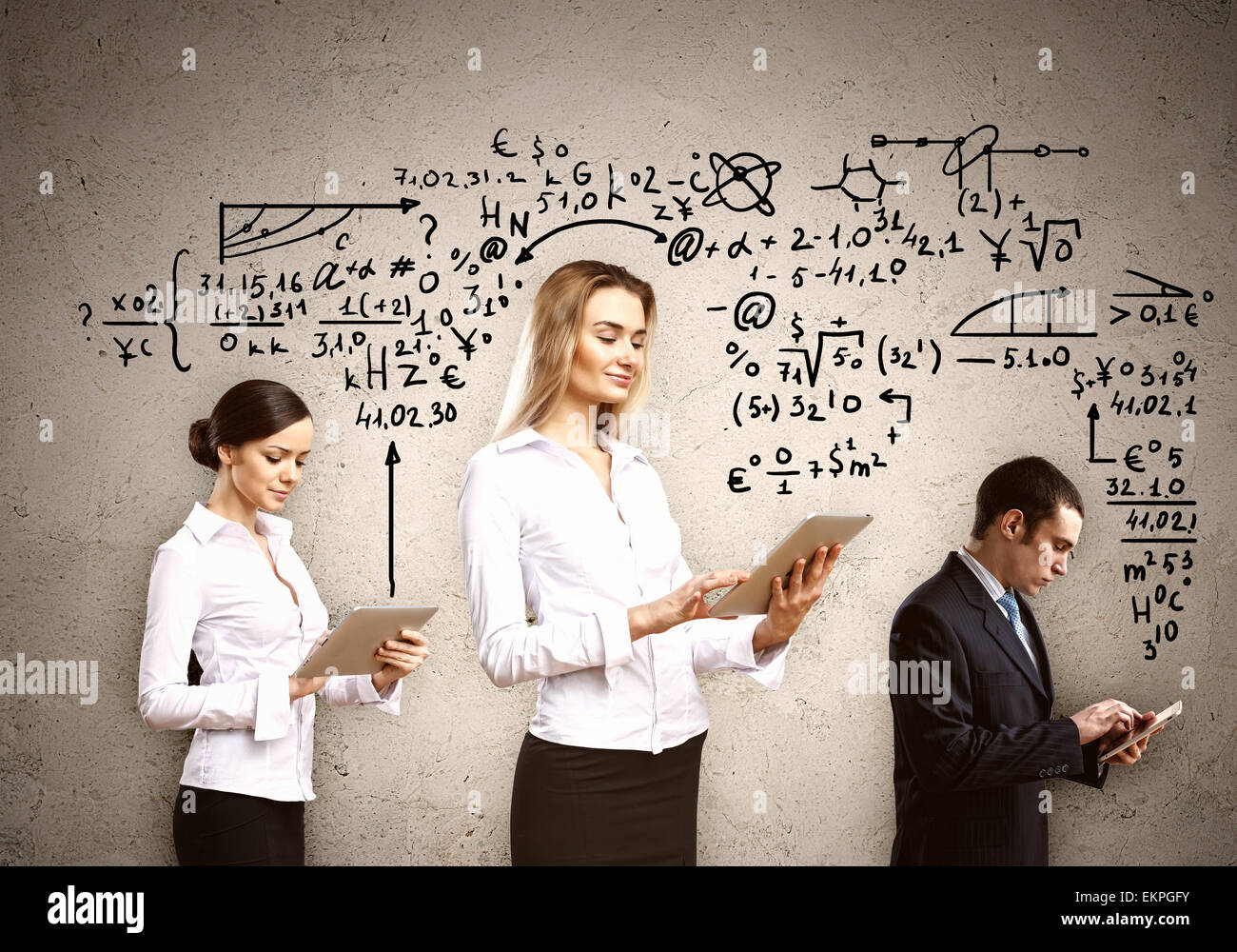 Three young people with tablet pc Stock Photo - Alamy