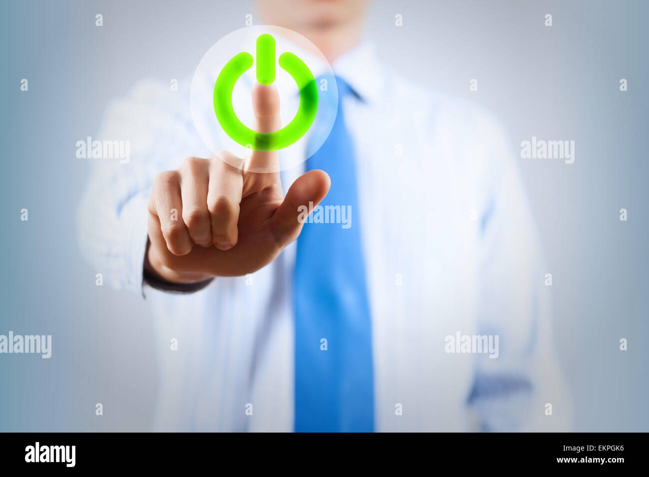 Young man press the power button Stock Photo - Alamy