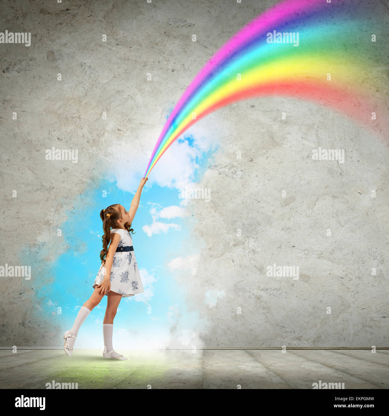Little girl drawing rainbow Stock Photo - Alamy
