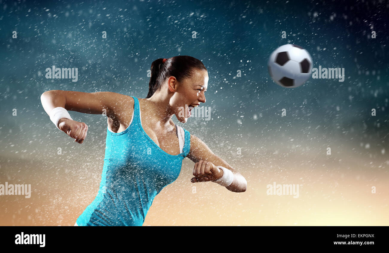 Young woman football player Stock Photo - Alamy