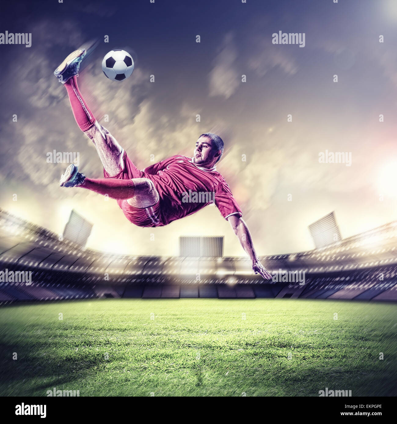 football player striking the ball Stock Photo - Alamy