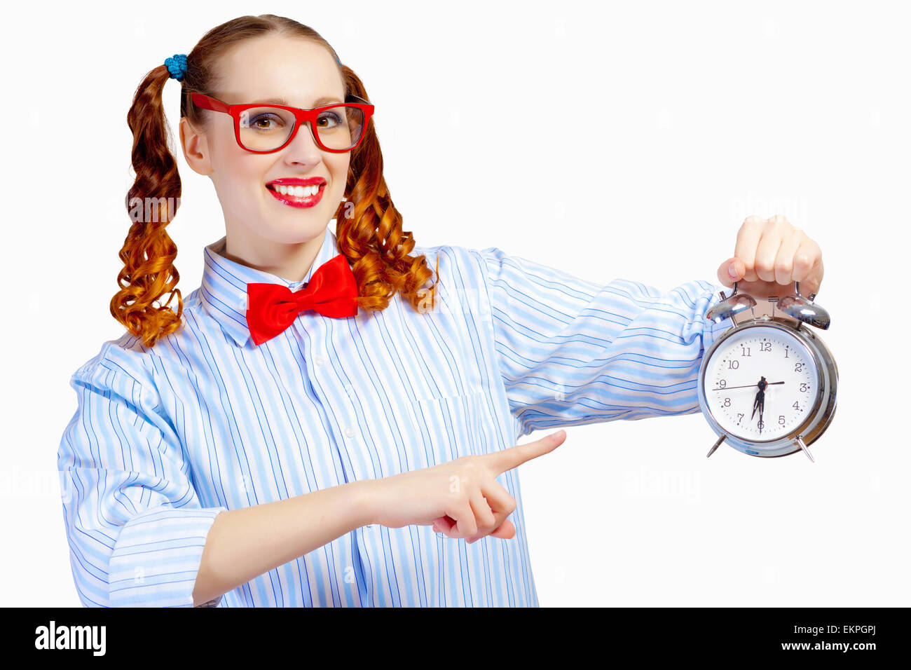 Teenager girl with alarm clock Stock Photo - Alamy