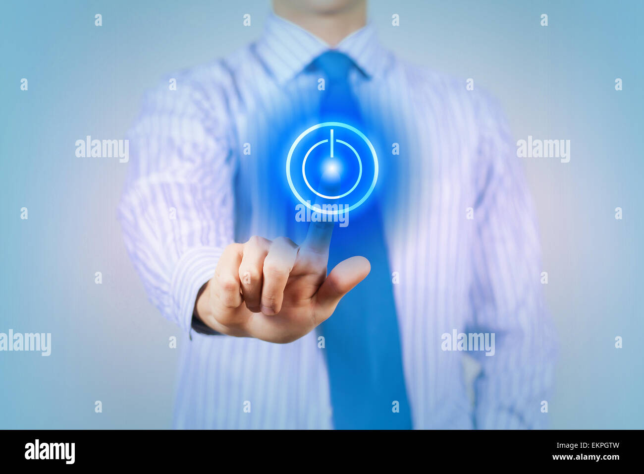 Young man press the power button Stock Photo - Alamy