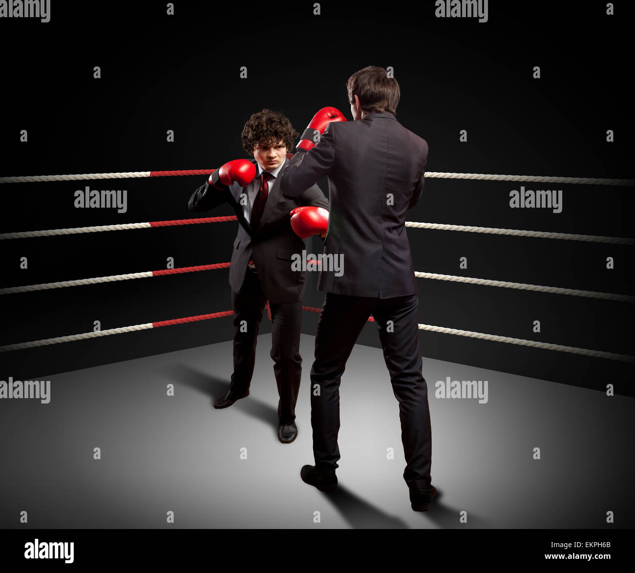 Two young businessman boxing Stock Photo - Alamy