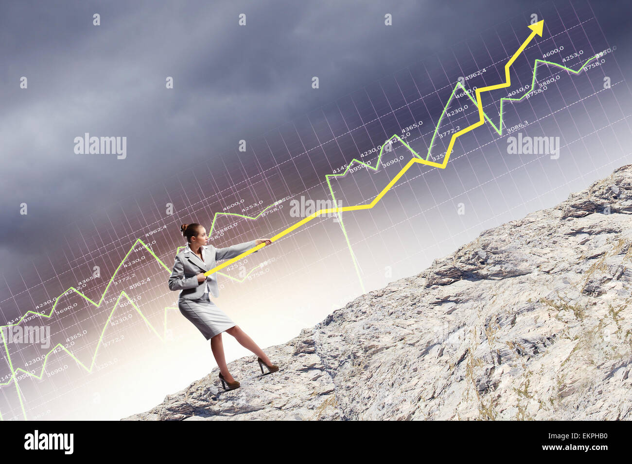 Businesswoman pulling graphic Stock Photo - Alamy