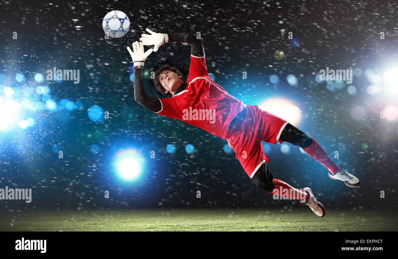 Goalkeeper catches the ball Stock Photo - Alamy