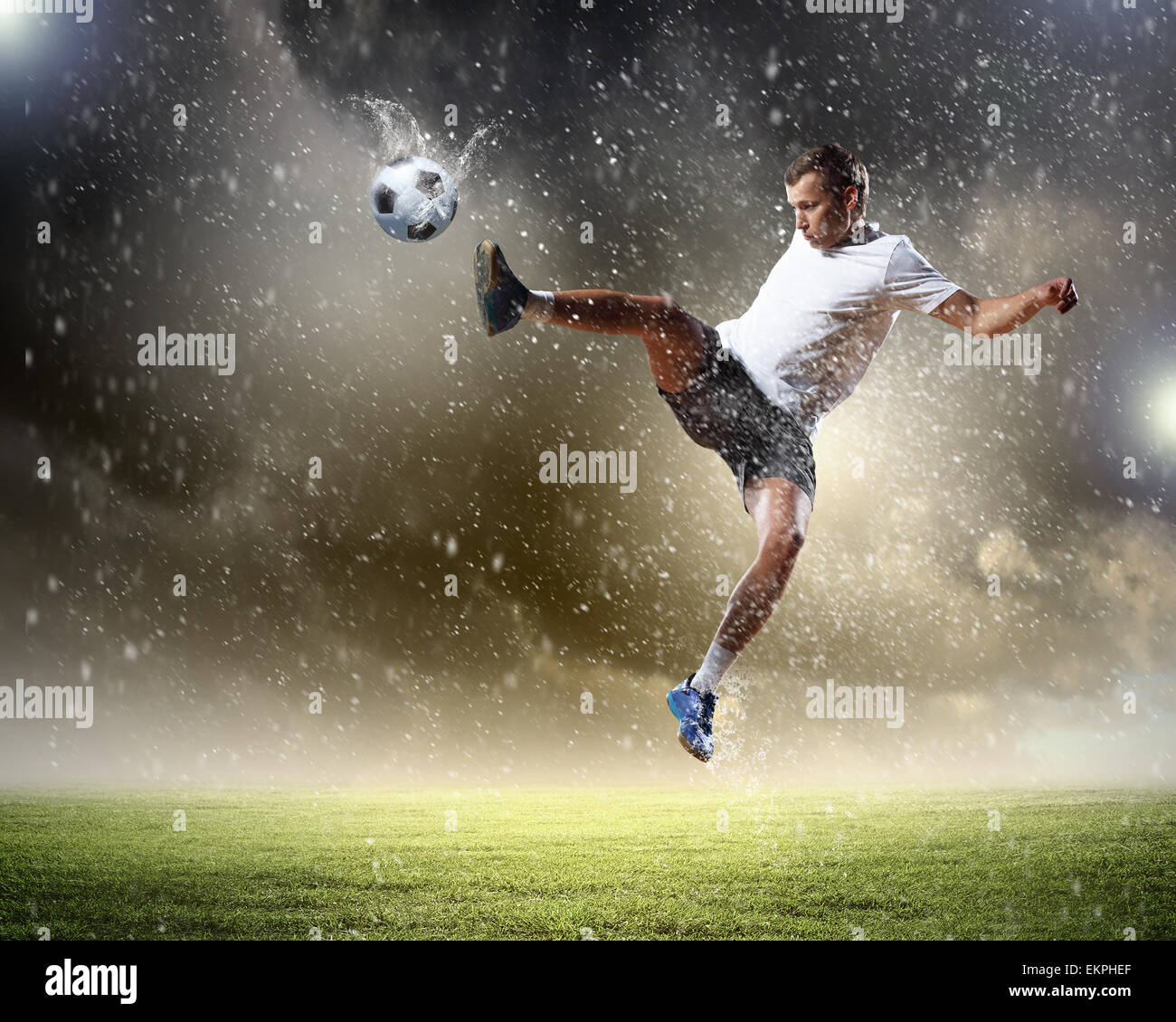 Image of football player at stadium hitting ball hi-res stock ...