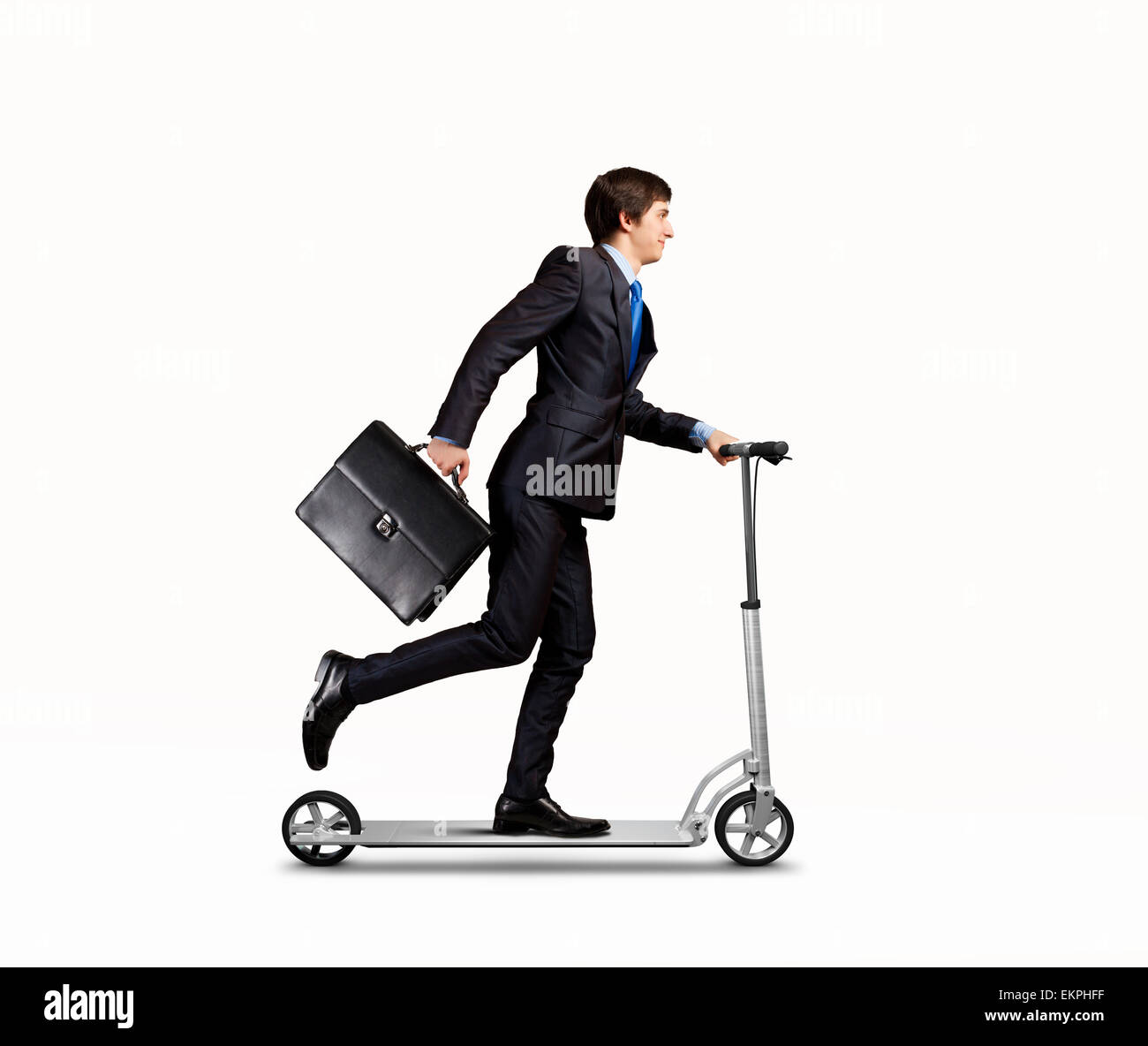 Businessman riding scooter Stock Photo - Alamy