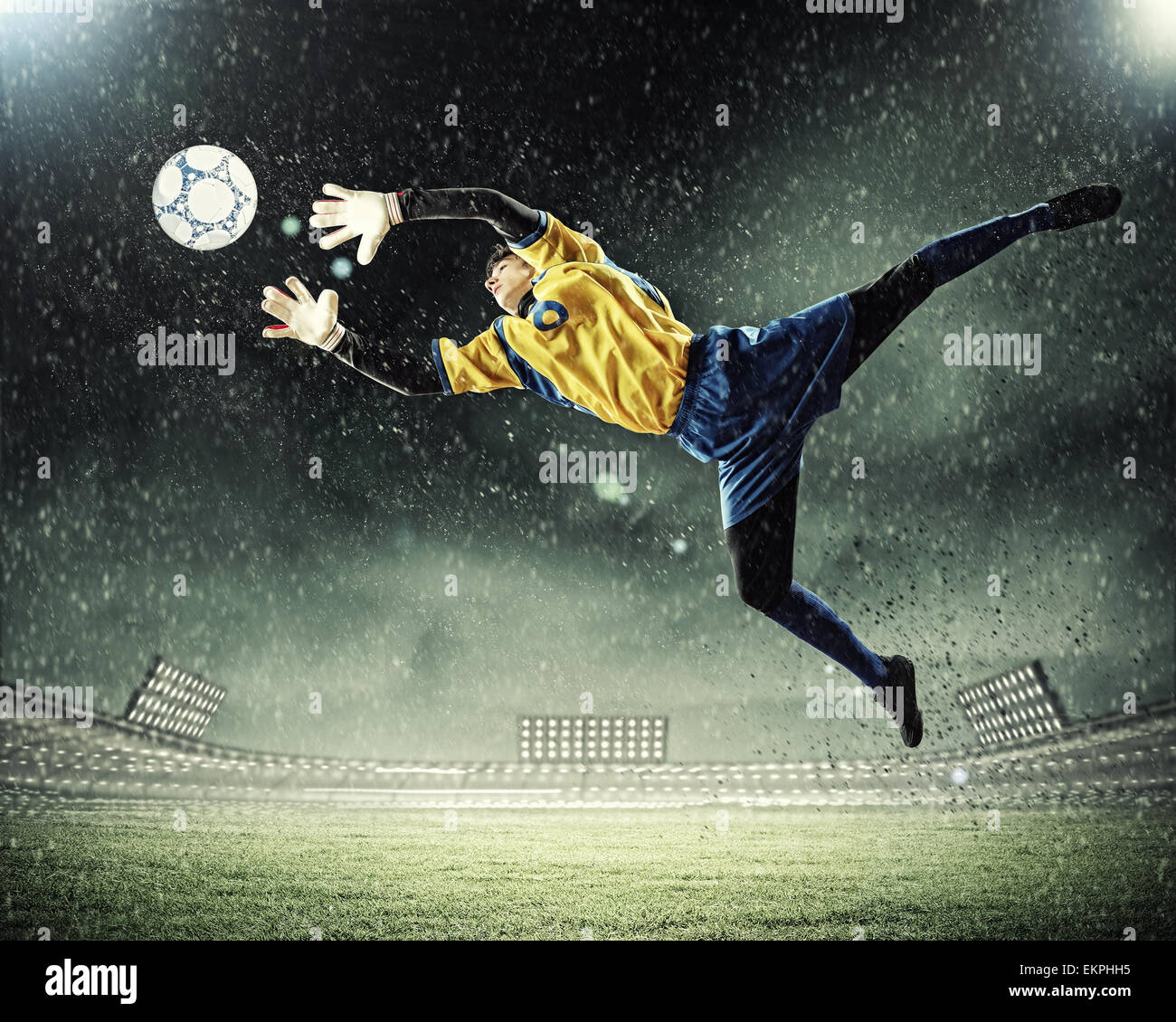Goalkeeper catches the ball Stock Photo - Alamy