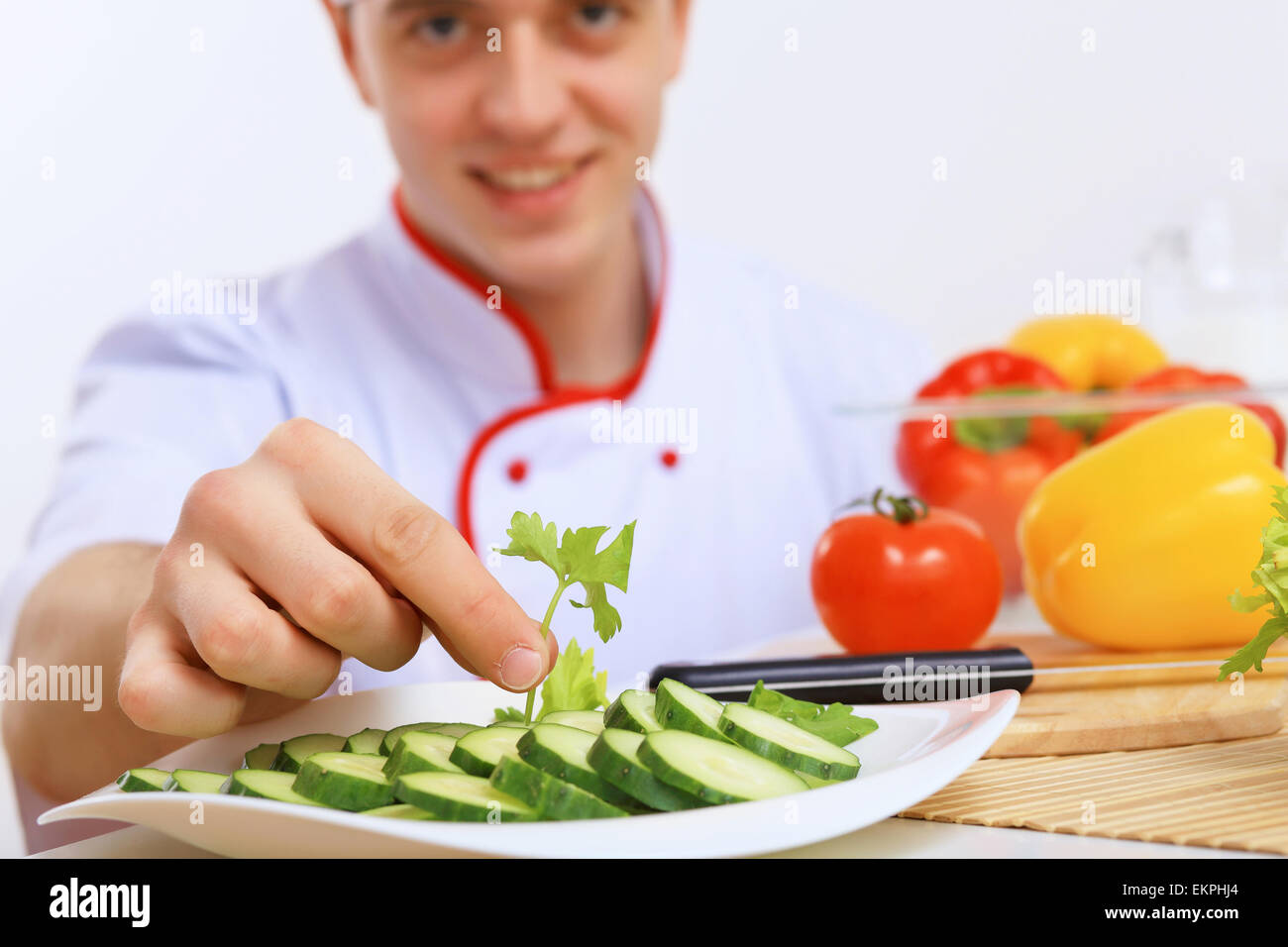Young cook preparing food Stock Photo - Alamy