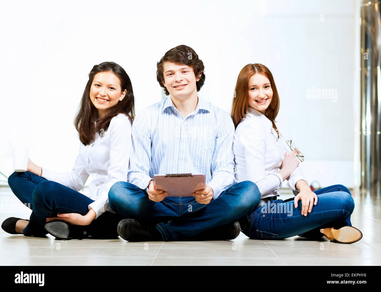 Three students smiling Stock Photo - Alamy