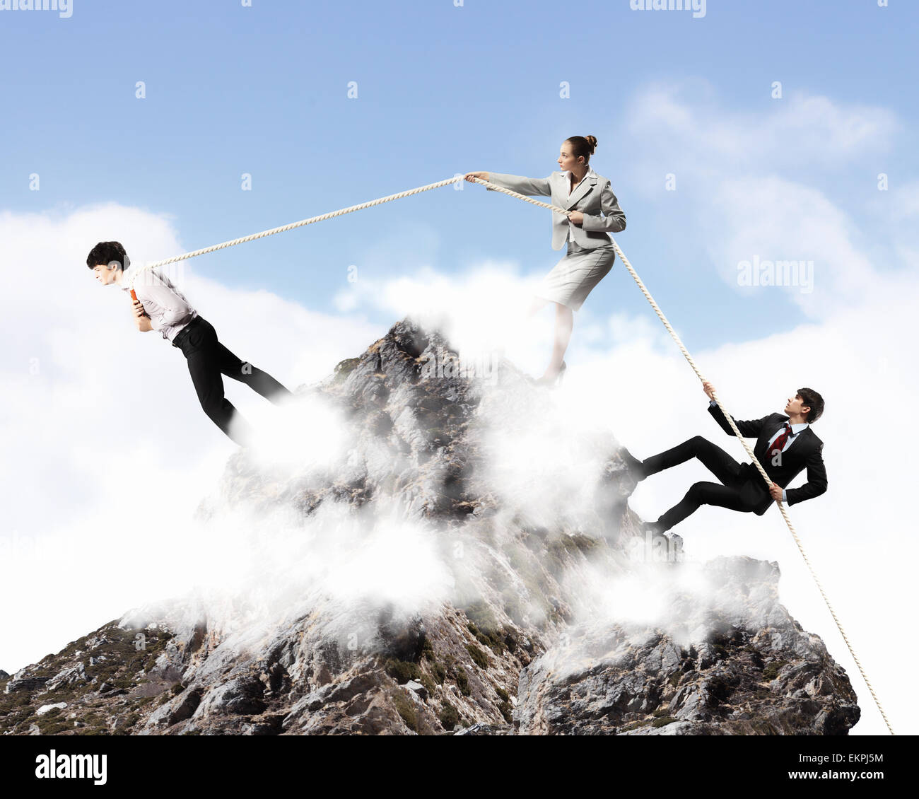 Three business people pulling rope Stock Photo - Alamy