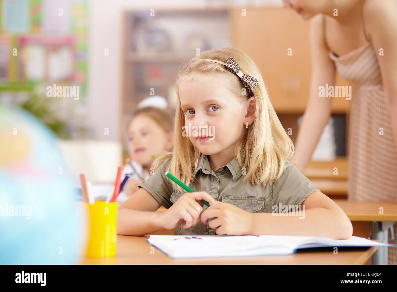 Little girl at school class Stock Photo - Alamy