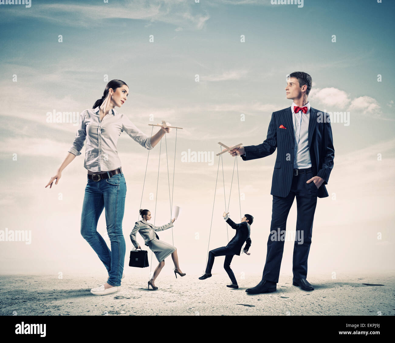Businesspeople with marionettes Stock Photo - Alamy