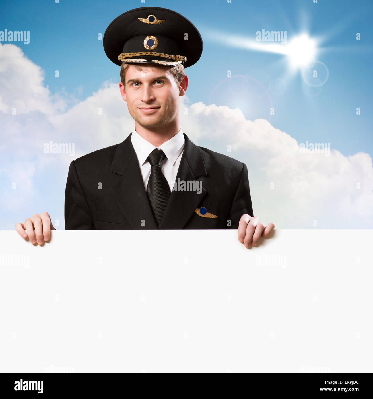 pilot in the form of holding an empty billboard Stock Photo - Alamy