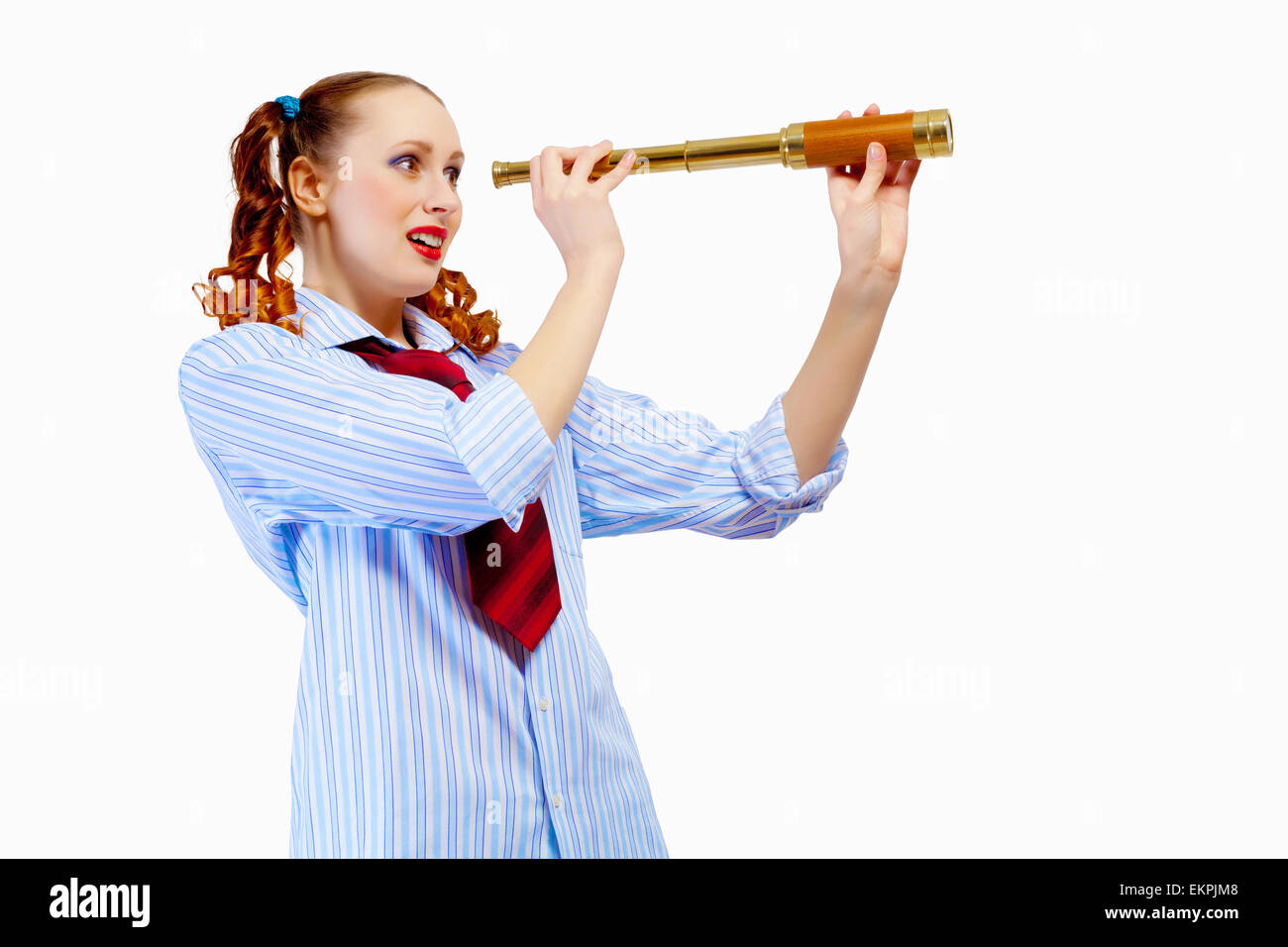 Young woman looking in telescope Stock Photo - Alamy