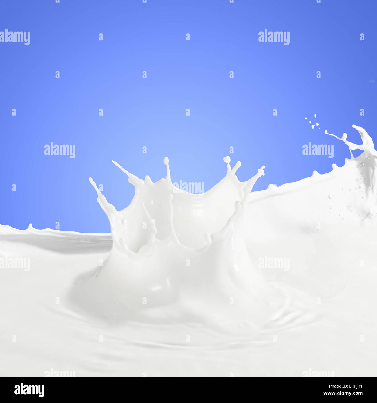 Pouring milk splash Stock Photo - Alamy